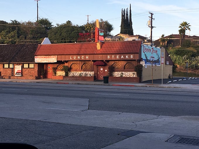 The Venice Room stands proudly on Garvey Avenue, its brick facade and "LUNCH STEAKS" sign a time-honored beacon for hungry locals since the Mad Men era.