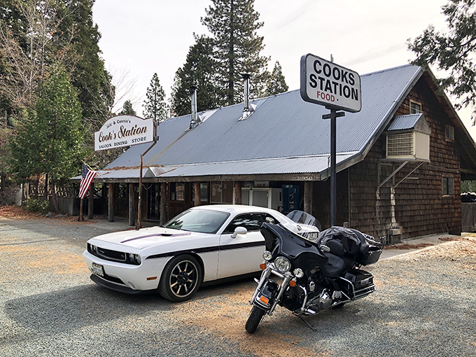 Where wilderness meets comfort food. This rustic mountain hideaway stands proudly among towering pines, promising culinary treasures for hungry travelers.