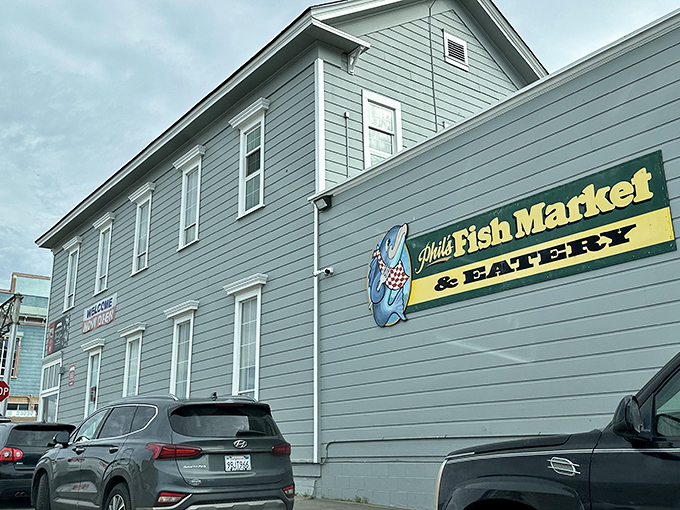The unassuming exterior of Phil's Fish Market & Eatery stands like a seafood speakeasy &ndash; complete with nautical guardians who've seen a thousand hungry pilgrims arrive skeptical and leave converted.