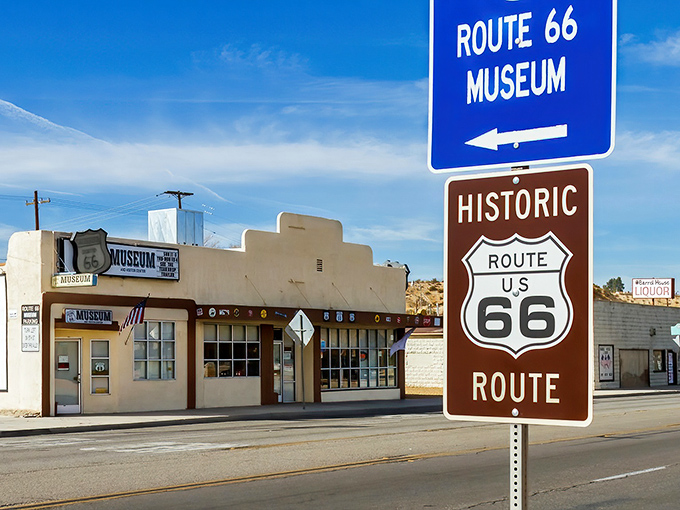 The unassuming exterior of the California Route 66 Museum stands as a portal to America's golden age of road travel. Blue skies and nostalgia await inside.