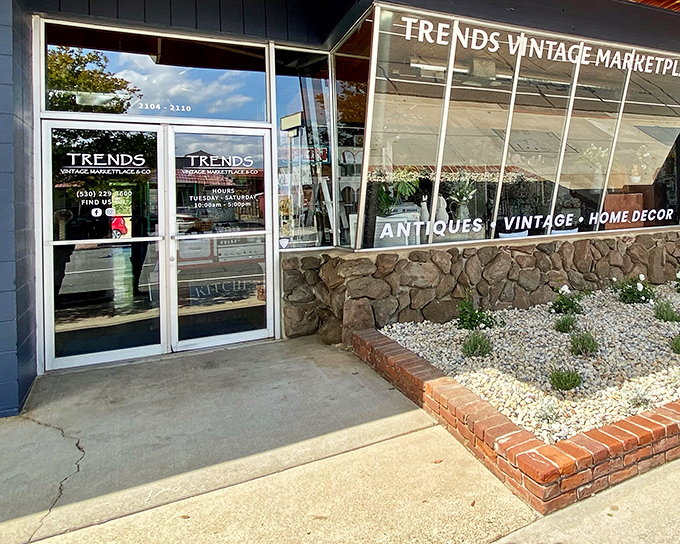 The unassuming exterior of Trends Vintage Marketplace belies the wonderland of treasures waiting inside. Spanish roof tiles and simple signage create vintage charm before you even enter.