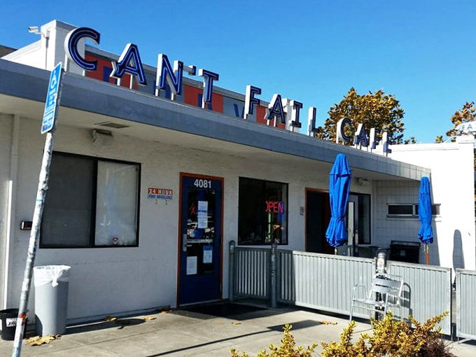 The iconic blue and red signage of Rudy's Can't Fail Cafe stands as a beacon for breakfast pilgrims. Even on the sunniest California days, it promises comfort inside.
