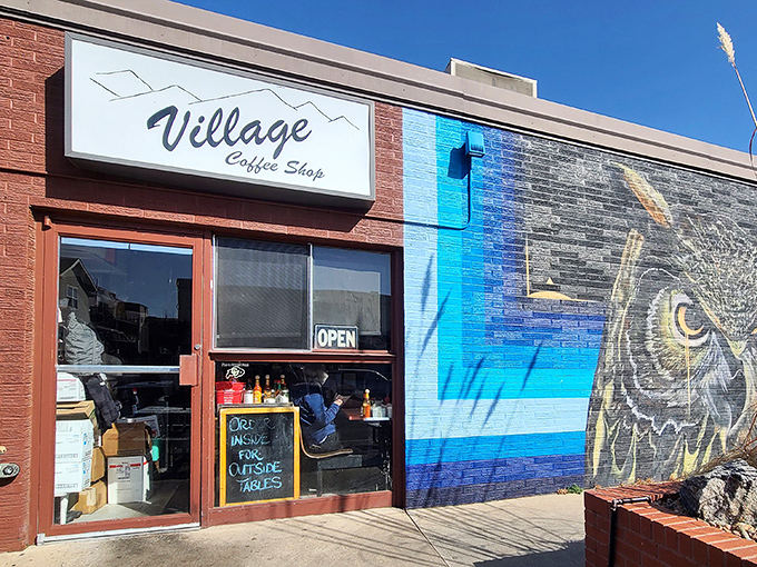 The iconic Village Coffee Shop sign stands proudly against the Colorado blue sky, promising breakfast salvation to hungry Boulder residents.