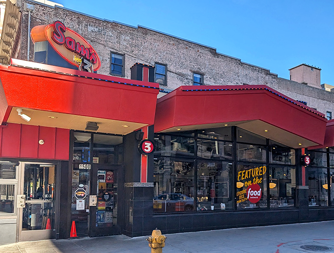 The neon glow of Sam's No. 3 against Denver's skyline isn't just a sign&mdash;it's a beacon of culinary comfort calling hungry souls home.