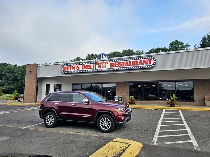 A neon beacon of deliciousness! Rein's Deli's sign promises New York-style eats that'll transport your taste buds faster than a subway ride to Manhattan.