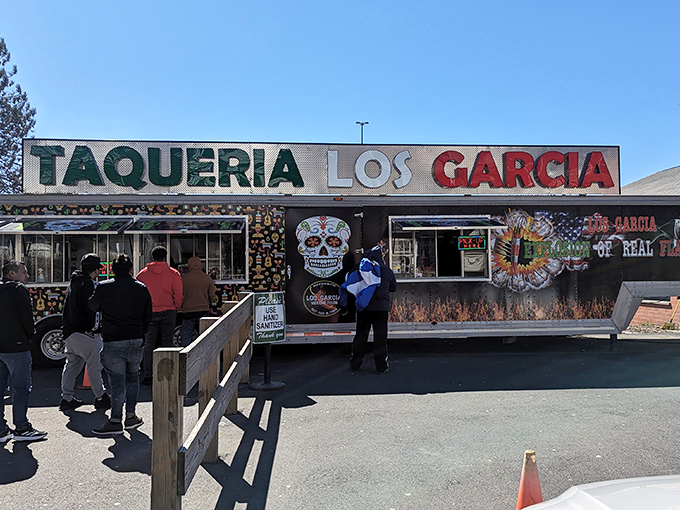 The colorful exterior of Los Garcia beckons hungry patrons with its vibrant sugar skull artwork and Mexican flag colors. Worth the wait in any weather!