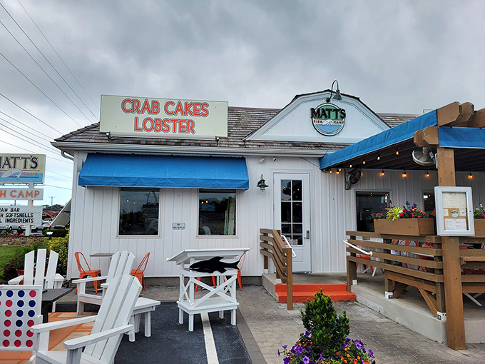 A coastal dream come true! Matt's Fish Camp's charming exterior with its blue accents, vibrant flower boxes, and inviting pergola practically whispers "come in, the seafood's fantastic."