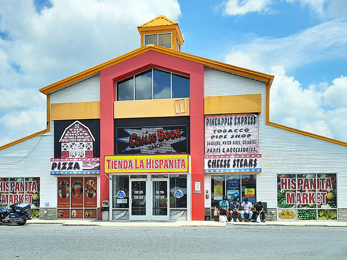 The unmistakable red and yellow facade of Laurel Junction Flea Market stands like a beacon for bargain hunters and culinary adventurers alike.