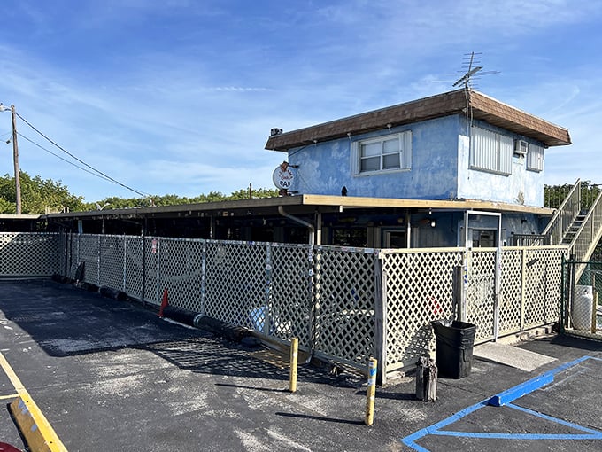The unassuming exterior of Alabama Jack's promises little but delivers big&mdash;white lattice, plastic chairs, and Florida sunshine setting the perfect stage for seafood magic.