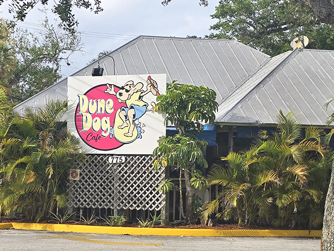 The surfing dog on the sign says it all – this Jupiter gem is where beach vibes and comfort food create the perfect Florida escape.
