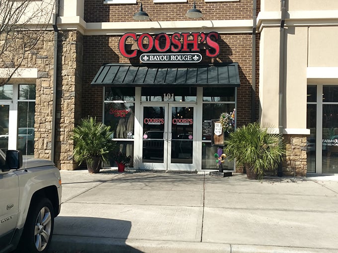 The brick facade of Coosh's Bayou Rouge beckons with its bold red signage &ndash; a little slice of Louisiana hospitality waiting to welcome hungry Tallahassee visitors.