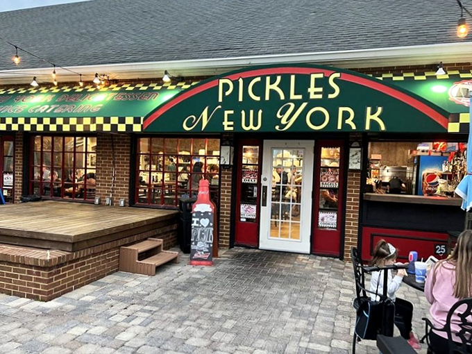 The iconic green and red awning of Pickles beckons like a New York mirage in the Florida sunshine. A delicious portal to another world.
