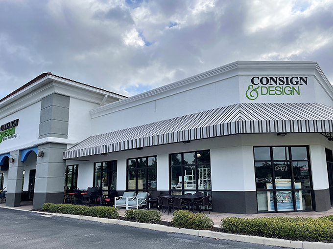 The white stucco exterior with its distinctive striped awnings might not scream "treasure trove," but inside awaits a wonderland of secondhand luxury.