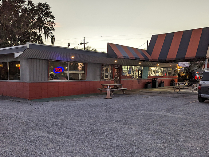 The iconic triangular roof of Jimbo's stands like a barbecue bat-signal, beckoning hungry travelers to this Lakeland landmark.