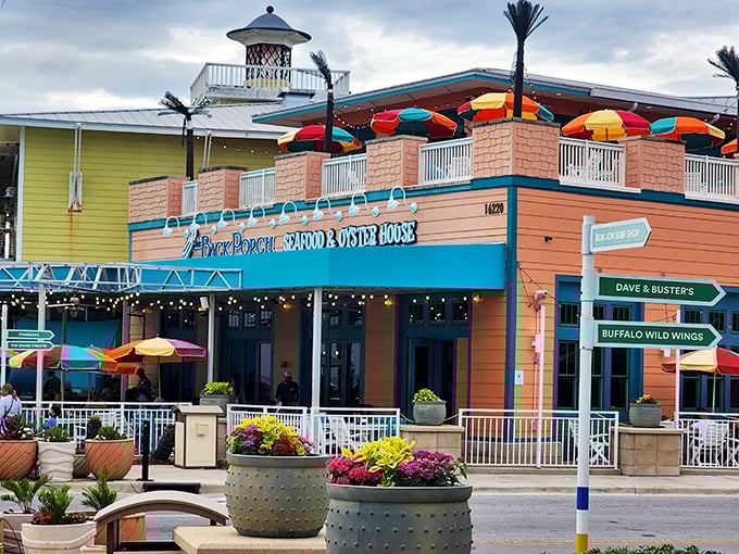 The salmon-pink exterior with turquoise trim isn't trying to be fancy&mdash;it's the architectural equivalent of saying "kick off your flip-flops and stay awhile."