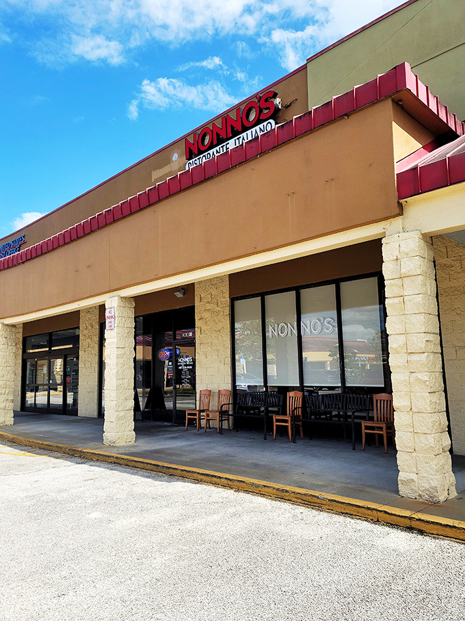 Nonno's welcomes hungry travelers with its cheerful red signage, like a beacon of Italian comfort food in a Florida strip mall. 