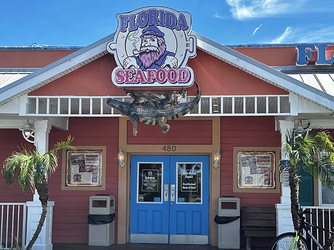 The coral-colored exterior with bright blue doors isn't just eye-catching&mdash;it's practically shouting "Fresh seafood inside!" like a friendly maritime beacon.