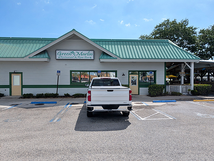 The distinctive green roof isn't just for show&mdash;it's nature's way of saying "seafood this way!" Florida architecture that promises coastal comfort inside.