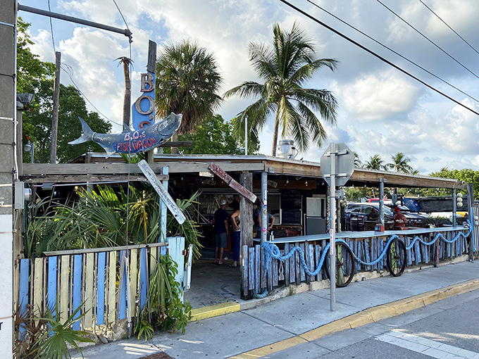 The ultimate Florida Keys contradiction: a ramshackle exterior that houses culinary treasures. Palm trees and power lines frame this beloved Key West institution.