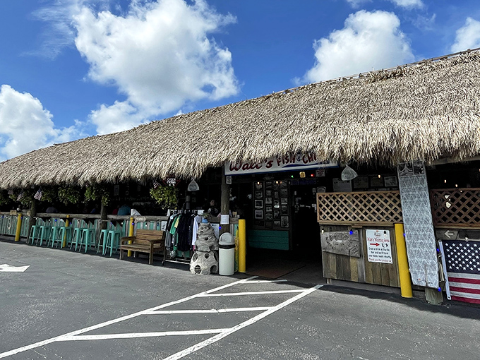 The thatched tiki roof of Walt's Fish Market beckons like a tropical mirage, promising seafood so fresh it practically introduces itself.
