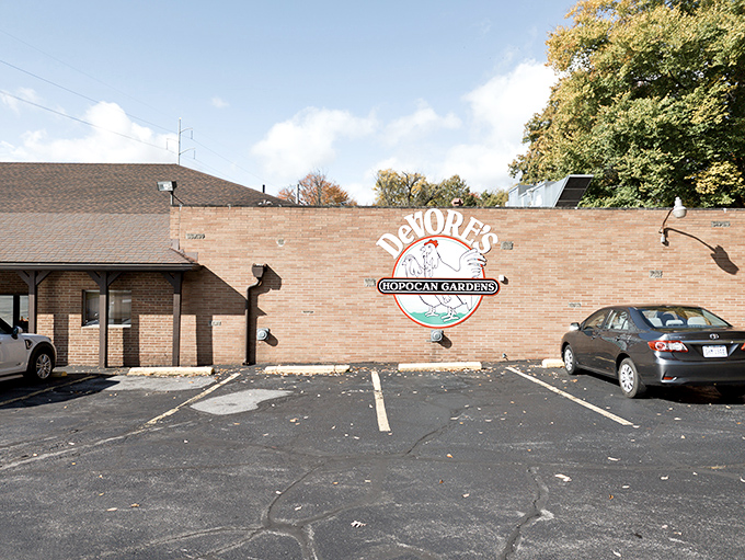 The unassuming brick exterior of DeVore's Hopocan Gardens proves once again that culinary treasures often hide behind the most modest facades.