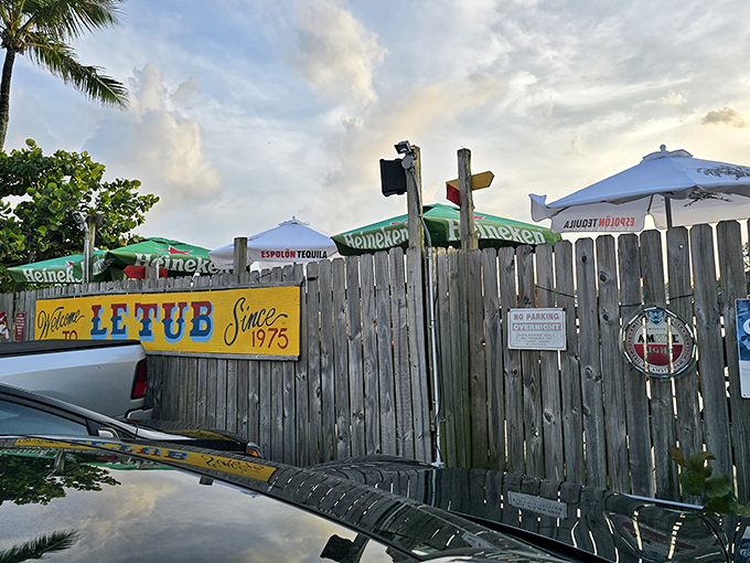 The unassuming wooden fence and yellow sign of Le Tub are Florida's version of a speakeasy entrance&mdash;secrets and seafood await behind these weathered boards.