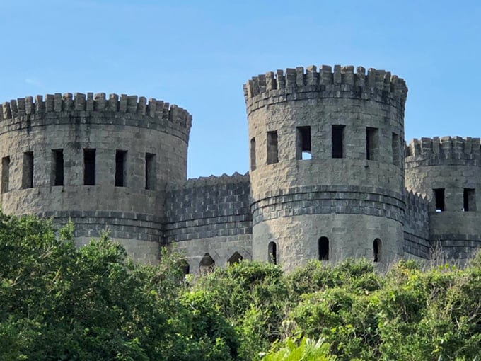 Castle Otttis emerges from Florida's coastal vegetation like a medieval mirage, its coquina stone towers standing defiantly against the bright blue sky.