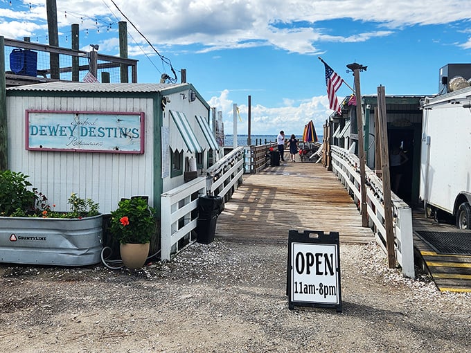 The entrance to seafood paradise begins with this unassuming wooden walkway. Like all great Florida treasures, Dewey Destin's doesn't need to shout about its brilliance.