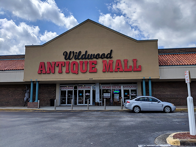 The unassuming exterior belies the wonderland within. Like finding a portal to the past, Wildwood Antique Mall's bold red sign beckons treasure hunters from miles around.