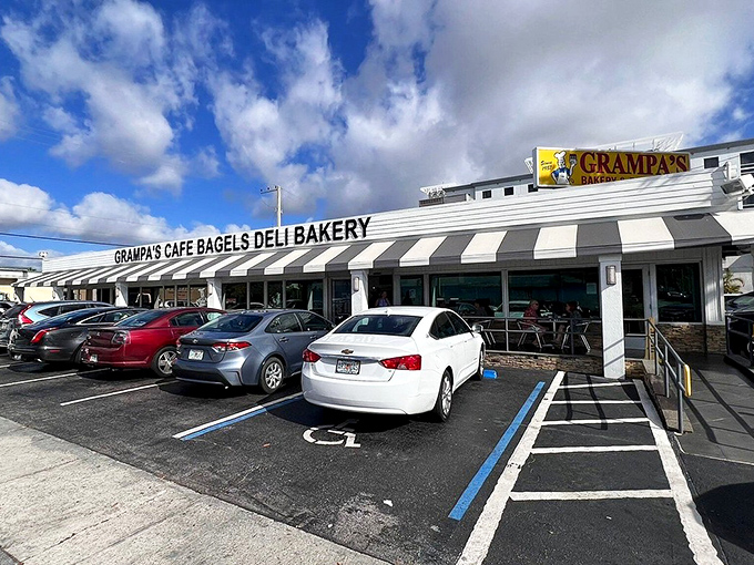 The promised land of carbs beckons with its classic striped awning. Grampa's exterior might be humble, but those full parking spaces tell the real story.