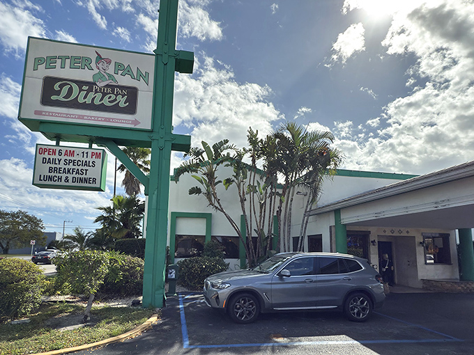 The iconic green and white sign welcomes hungry travelers like a beacon of breakfast hope. Palm trees and promise await.