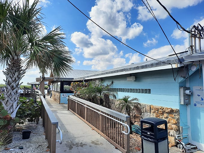 The weathered wooden exterior and bold blue sign announce you've arrived at seafood paradise. Florida authenticity doesn't get more real than this.
