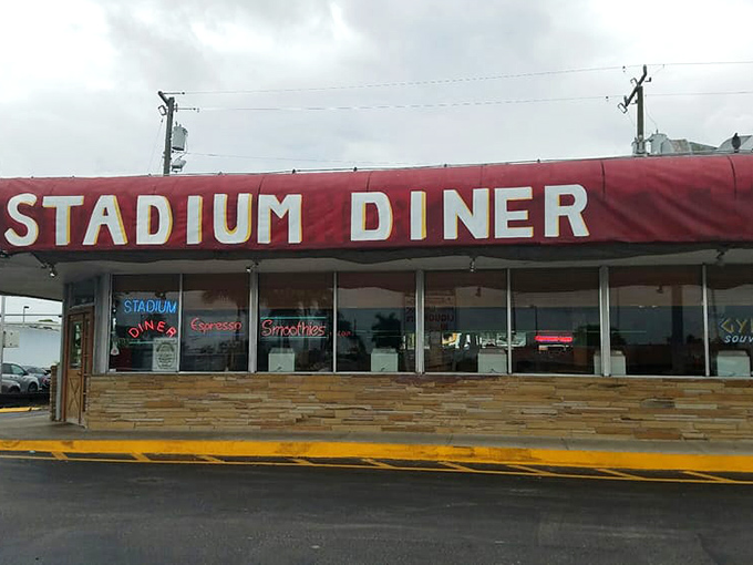 The iconic red awning of Stadium Diner stands as a beacon of breakfast hope for hungry Miamians seeking salvation from sad cereal.
