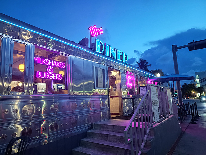 The gleaming stainless steel exterior of 11th Street Diner shines like a beacon of nostalgia under Miami's blue skies, promising comfort food and air conditioning in equal measure.