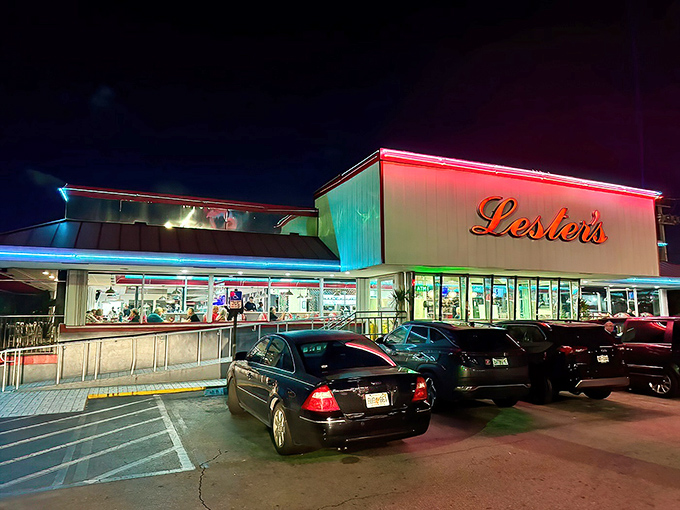 Lester's iconic exterior glows like a beacon of comfort food hope in the Florida night, promising oversized portions and nostalgic flavors within those neon-trimmed walls.