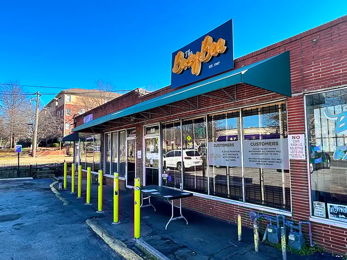 The unassuming brick exterior with its vintage yellow sign has been Atlanta's beacon of fried chicken excellence since 1947. Those yellow bollards might as well be velvet ropes.