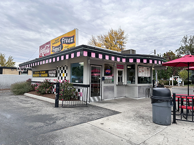 The checkered facade of Fanci Freez stands like a time portal to simpler days, when drive-thrus were social hubs and calories weren't counted, just savored. 