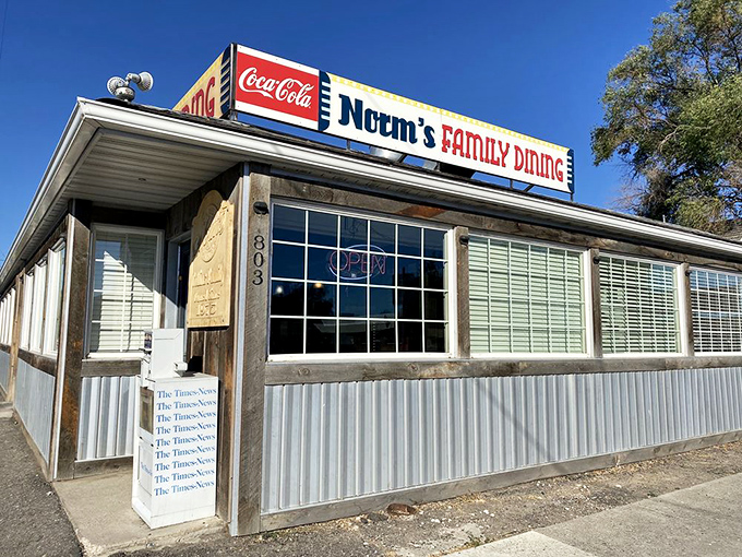 The unassuming exterior of Norm's Family Dining stands like a beacon of breakfast hope in Twin Falls, where pancake pilgrimages begin beneath that iconic red Coca-Cola sign.