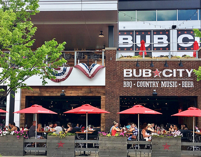 The patriotic bunting and bold signage of Bub City's exterior promises three essential food groups: BBQ, country music, and beer. A trifecta of American pleasure.