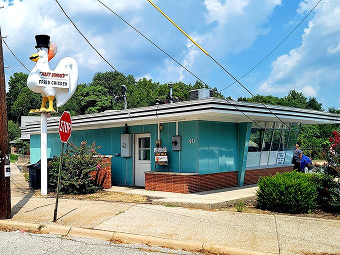The unassuming turquoise exterior of Fast Eddie's might not scream "culinary destination," but locals know this modest building houses fried chicken greatness.