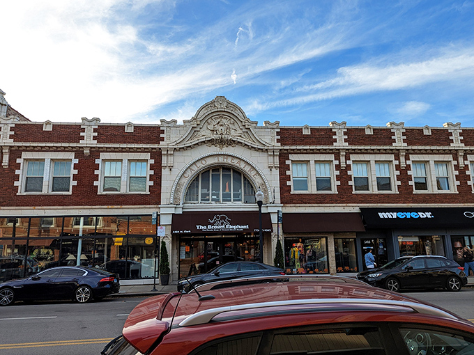 The grand entrance beckons like a theatrical invitation. This historic fa&ccedil;ade on Clark Street promises treasures within, its ornate white arch a portal to thrifting adventures. 