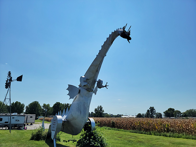 The magnificent Kaskaskia Dragon stands tall against the Illinois sky, its metallic neck arched skyward like a prehistoric creature frozen mid-roar.