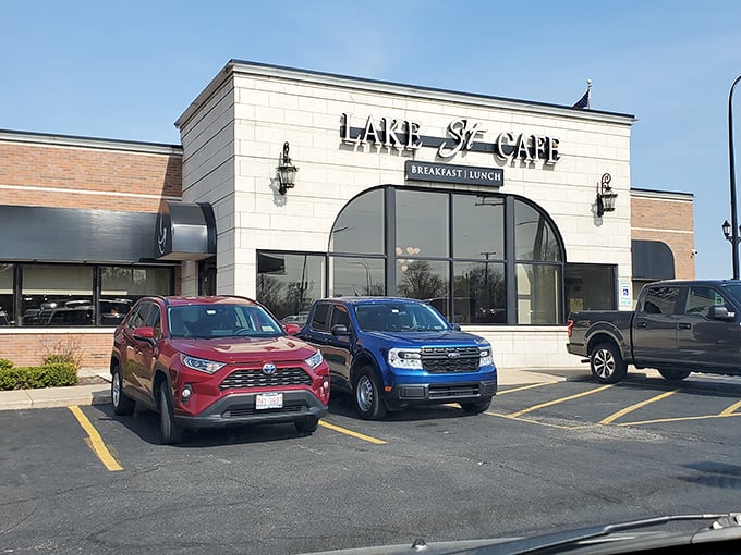 An unassuming strip mall storefront that proves culinary treasures don't always hide in fancy buildings. The American flag stands guard over breakfast paradise.