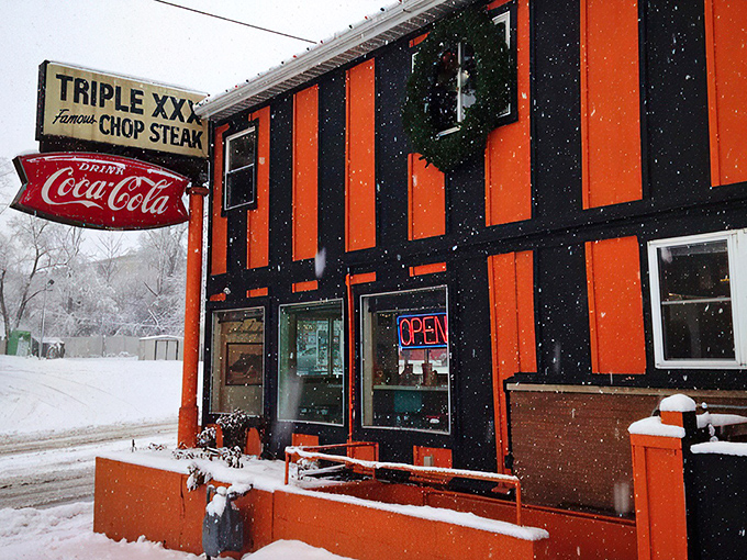 The iconic orange-and-black exterior stands defiant against an Indiana snowfall, like a warm beacon of comfort food calling through the winter chill.
