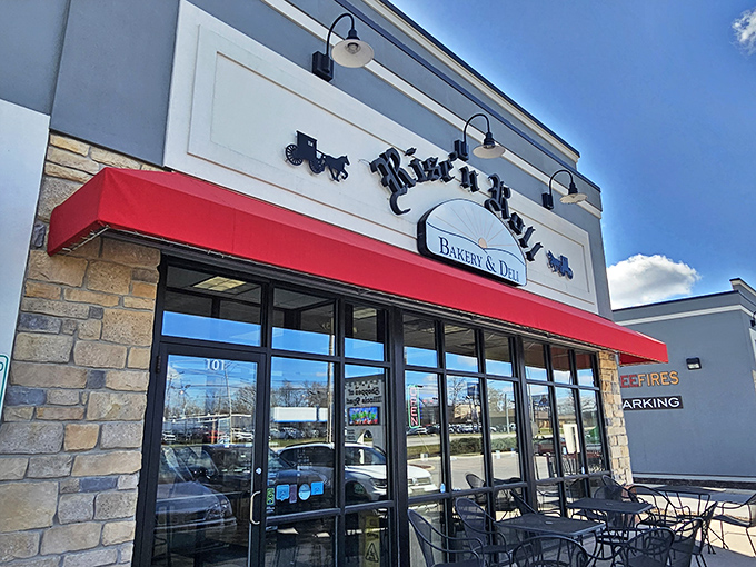 The iconic red awning of Rise'n Roll beckons like a lighthouse for carb-seeking sailors in a sea of chain restaurants.