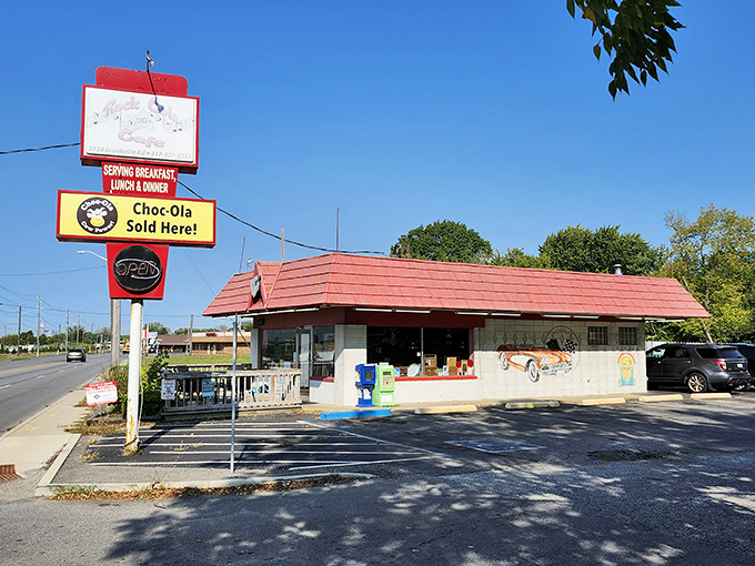 The classic red-roofed exterior of Rock-Cola 50's Cafe stands like a time capsule on Indy's east side, promising nostalgic flavors and memories with every visit.