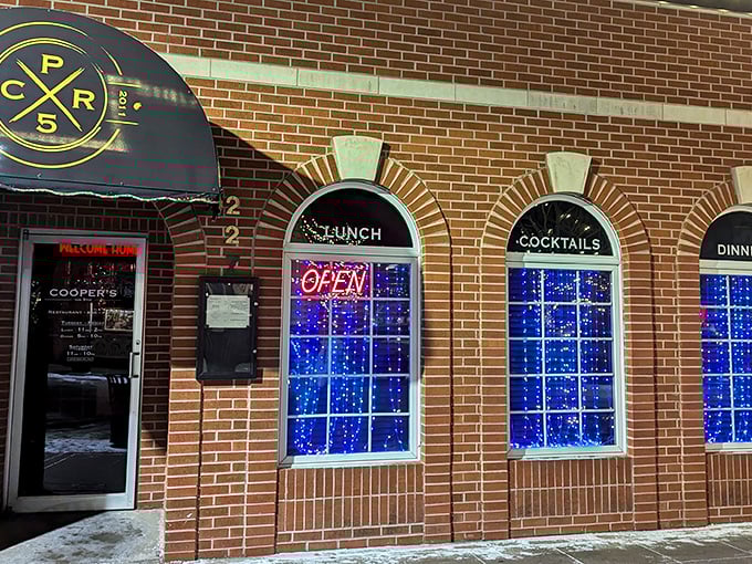 Classic brick charm meets modern comfort at Cooper's on 5th, where "LUNCH" and "COCKTAILS" promise double the happiness. 