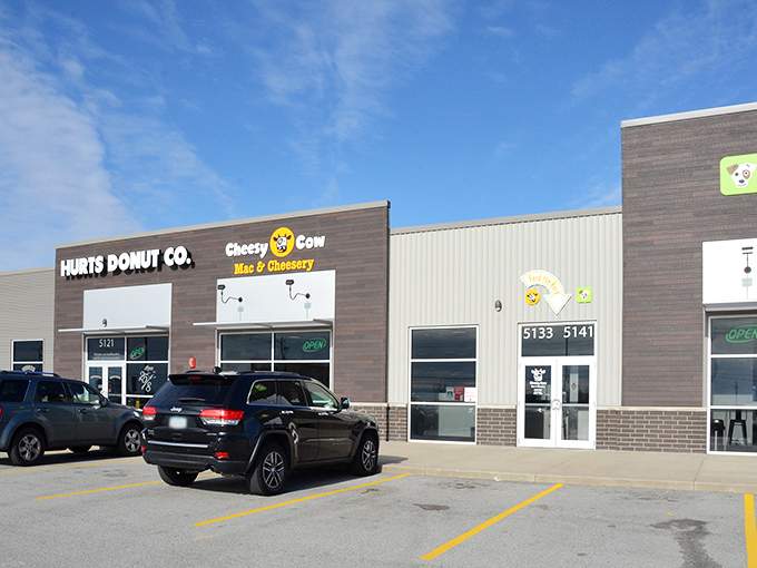 The unassuming storefront of Cheesy Cow sits like a dairy-filled oasis in a Bettendorf strip mall, promising comfort food nirvana to cheese pilgrims.