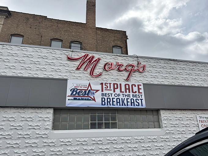 Morg's iconic white building with its bold red script sign stands as a beacon of breakfast hope on Mulberry Street in Waterloo.