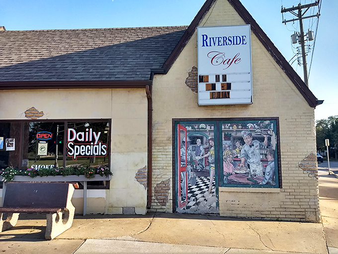 The unassuming A-frame exterior of Riverside Cafe stands like a time capsule, complete with a hand-painted mural promising culinary treasures within.